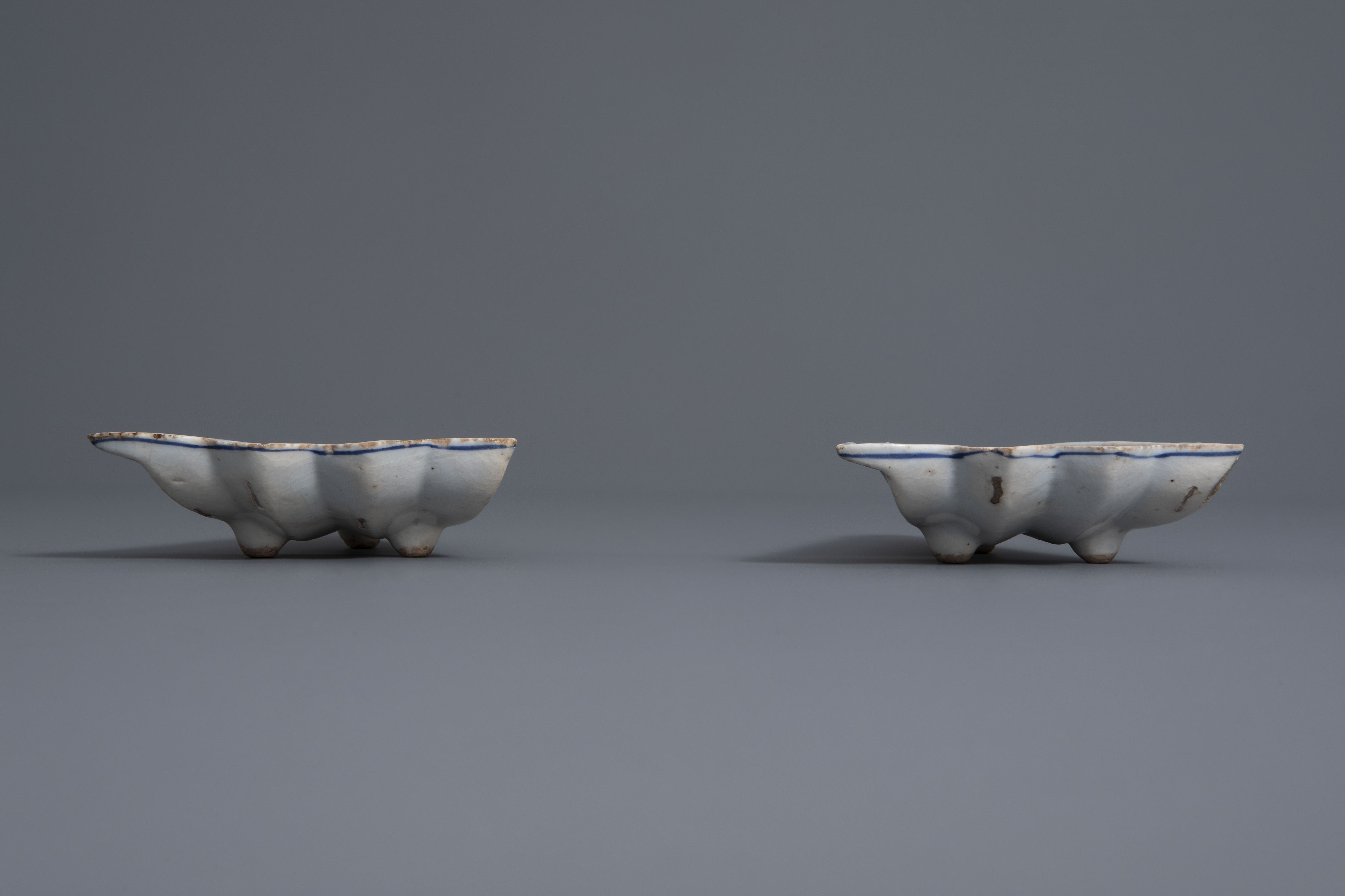 A pair of Japanese blue and white fan-shaped mukozuke dishes, Edo, 17th ...