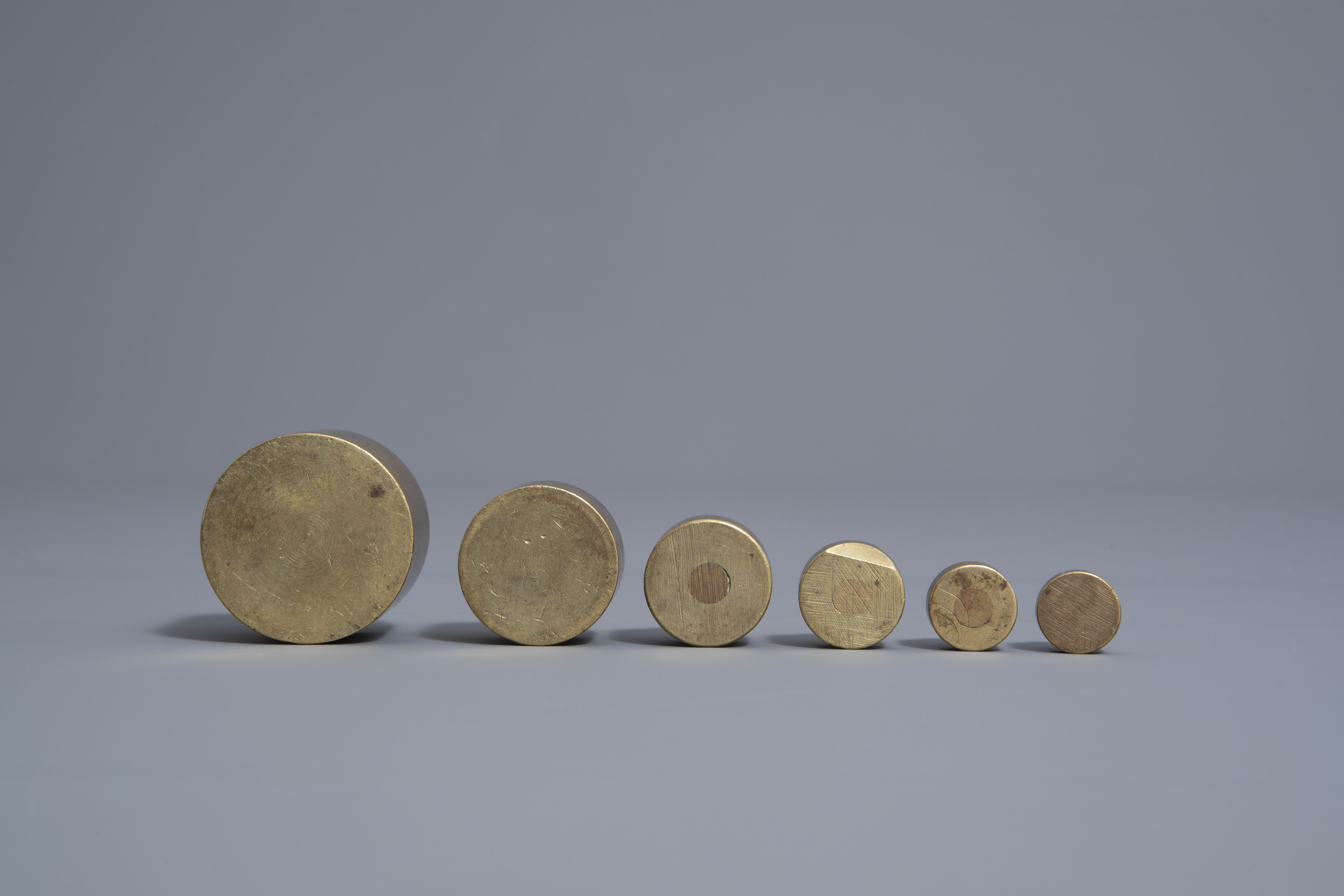 A French nine-piece set of copper bank weights for gold coins, 19th C ...