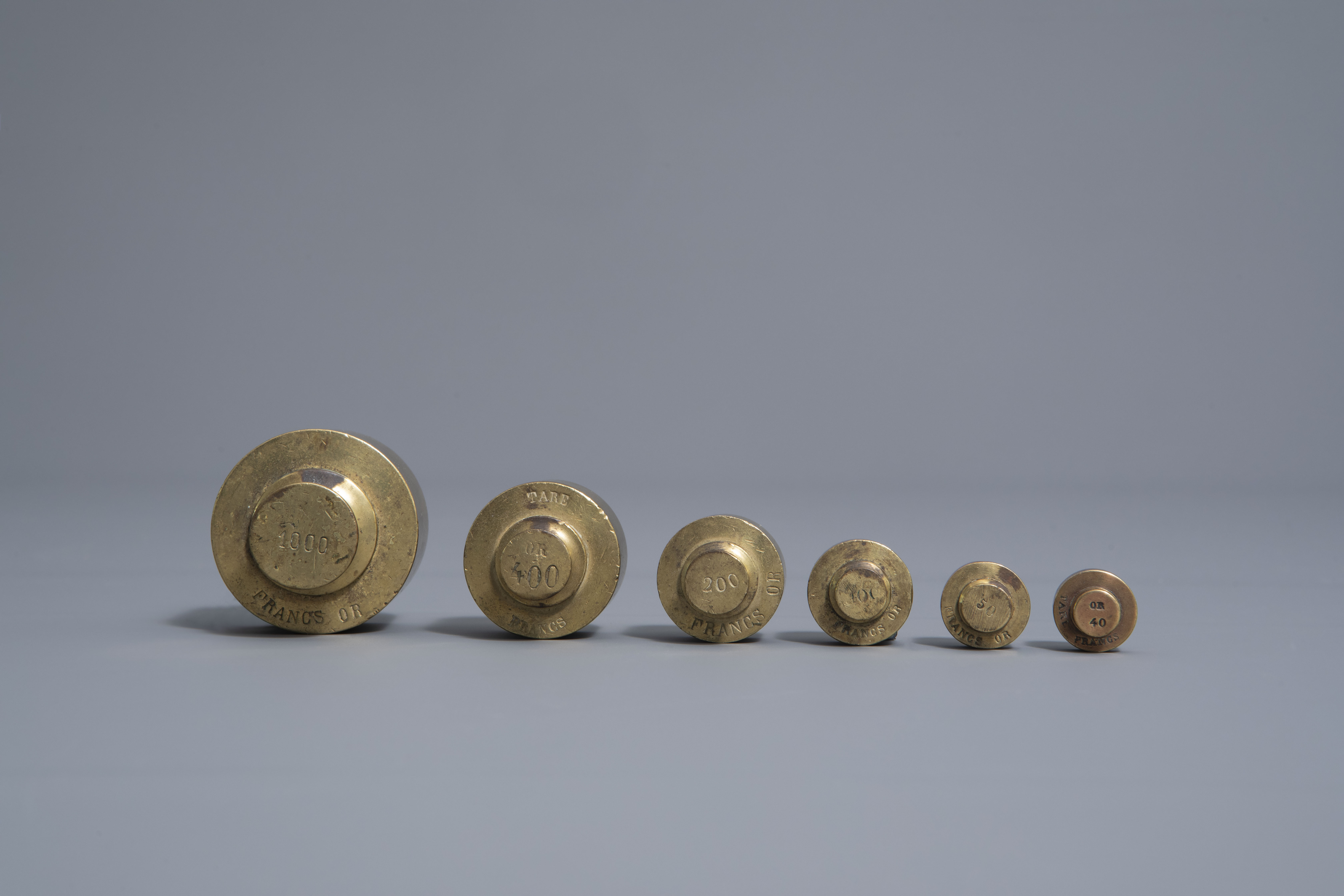 A French nine-piece set of copper bank weights for gold coins, 19th C ...