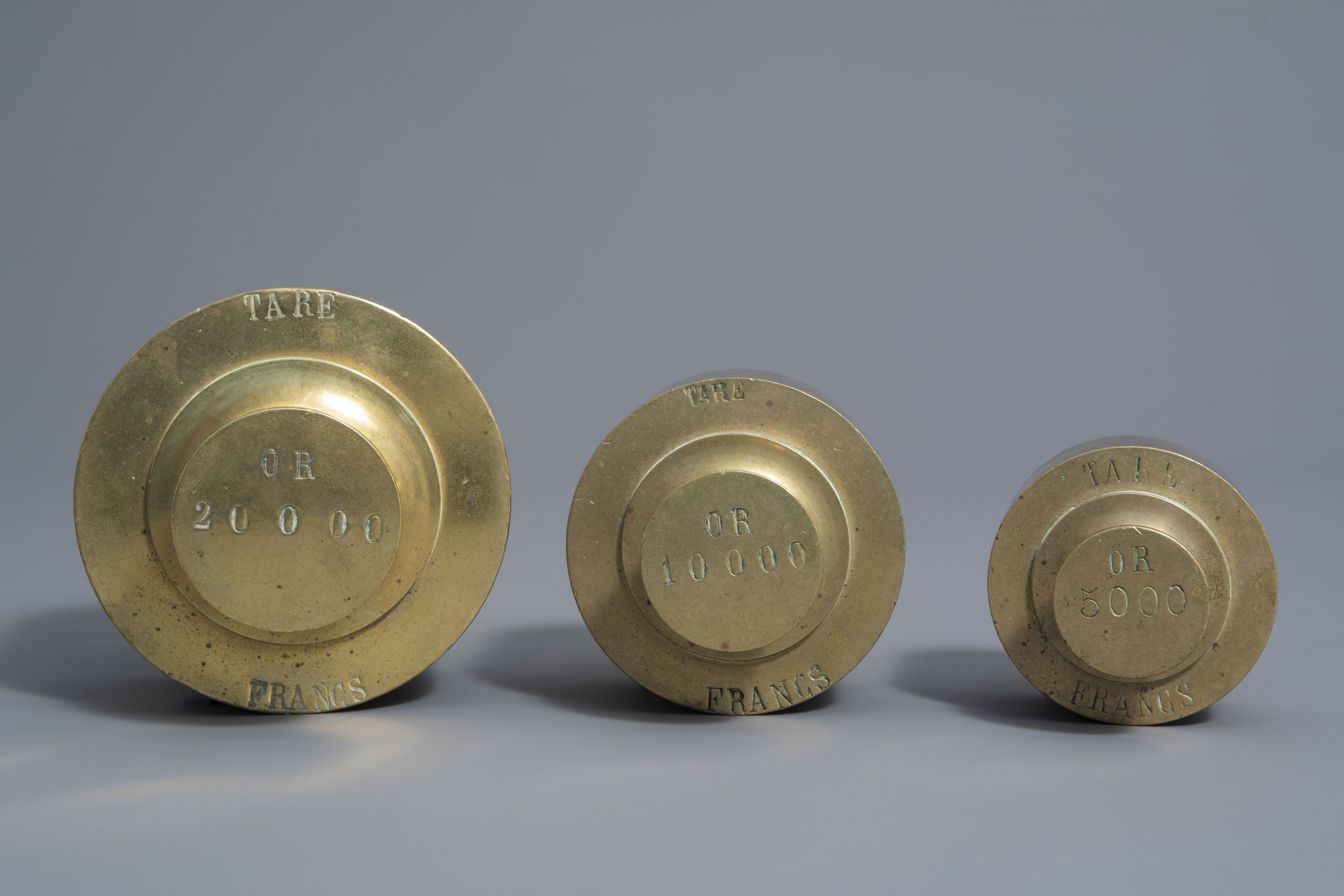 A French nine-piece set of copper bank weights for gold coins, 19th C ...
