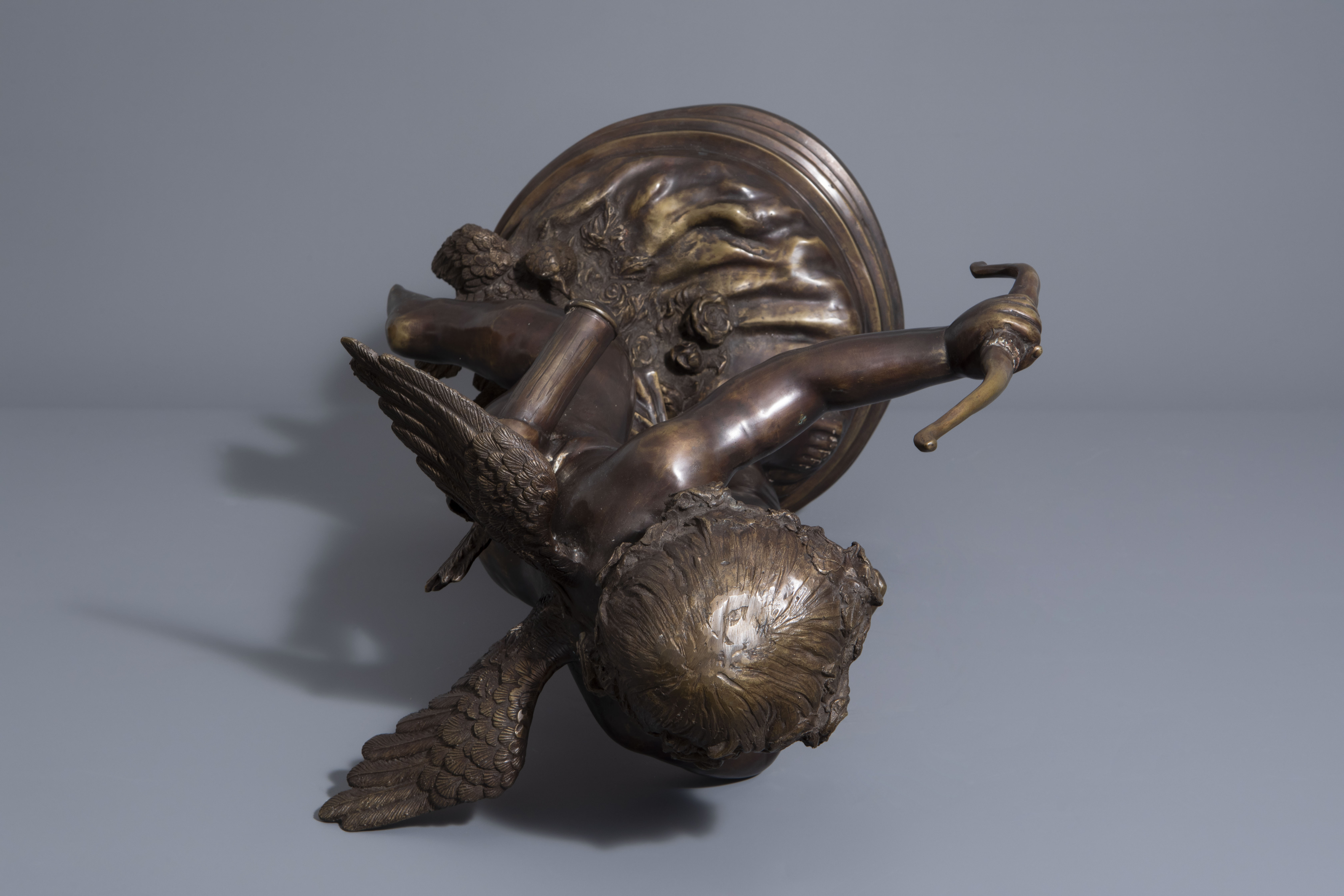 In the manner of Joseph d'Aste (1881-1945): Cupid, patinated bronze ...