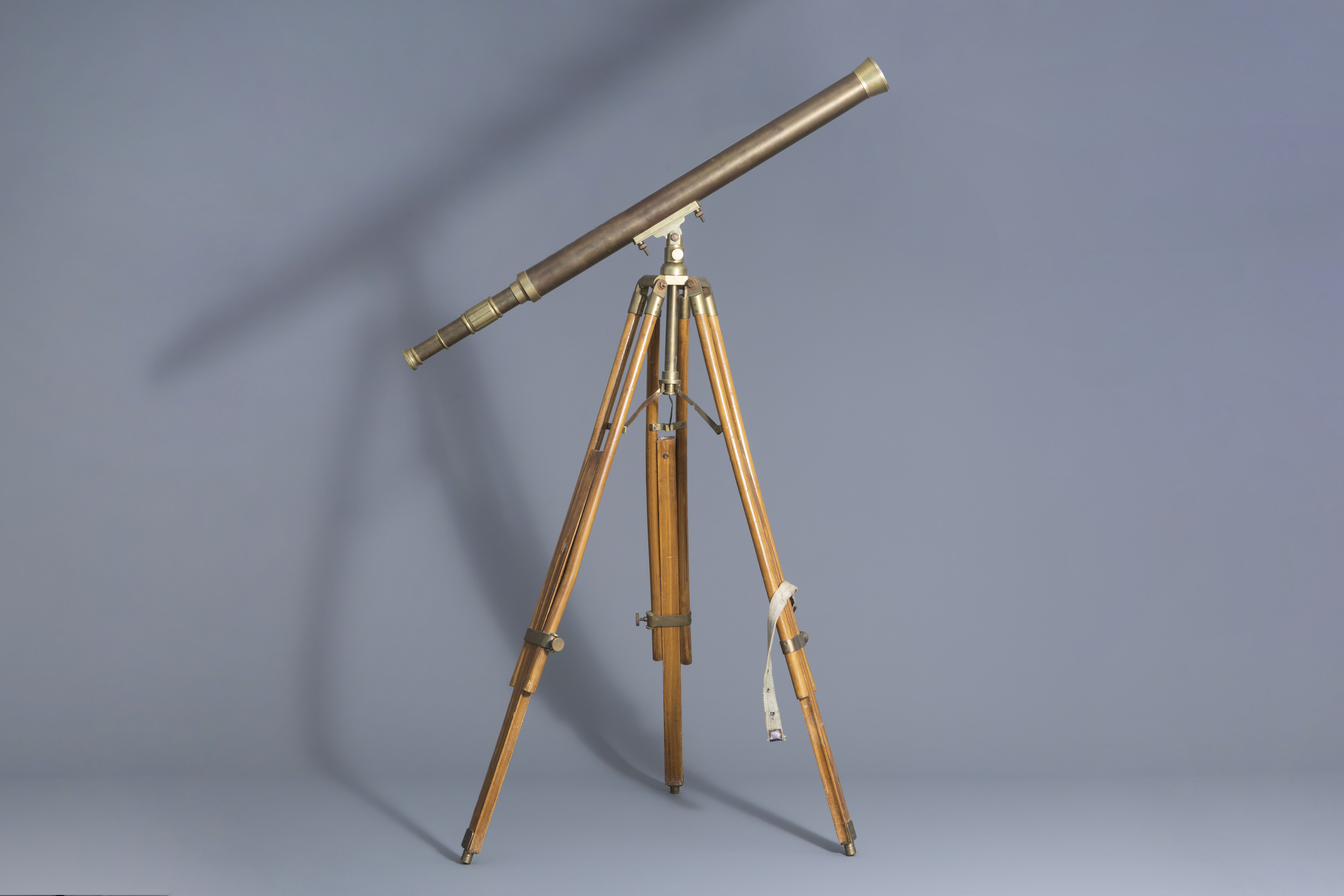 A Stanley London brass Harbor Master telescope on a wooden tripod stand ...