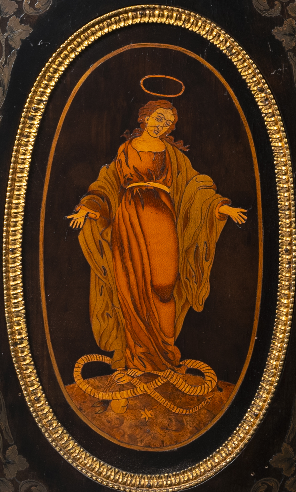 A varied collection of three religious paintings and a marquetry panel ...