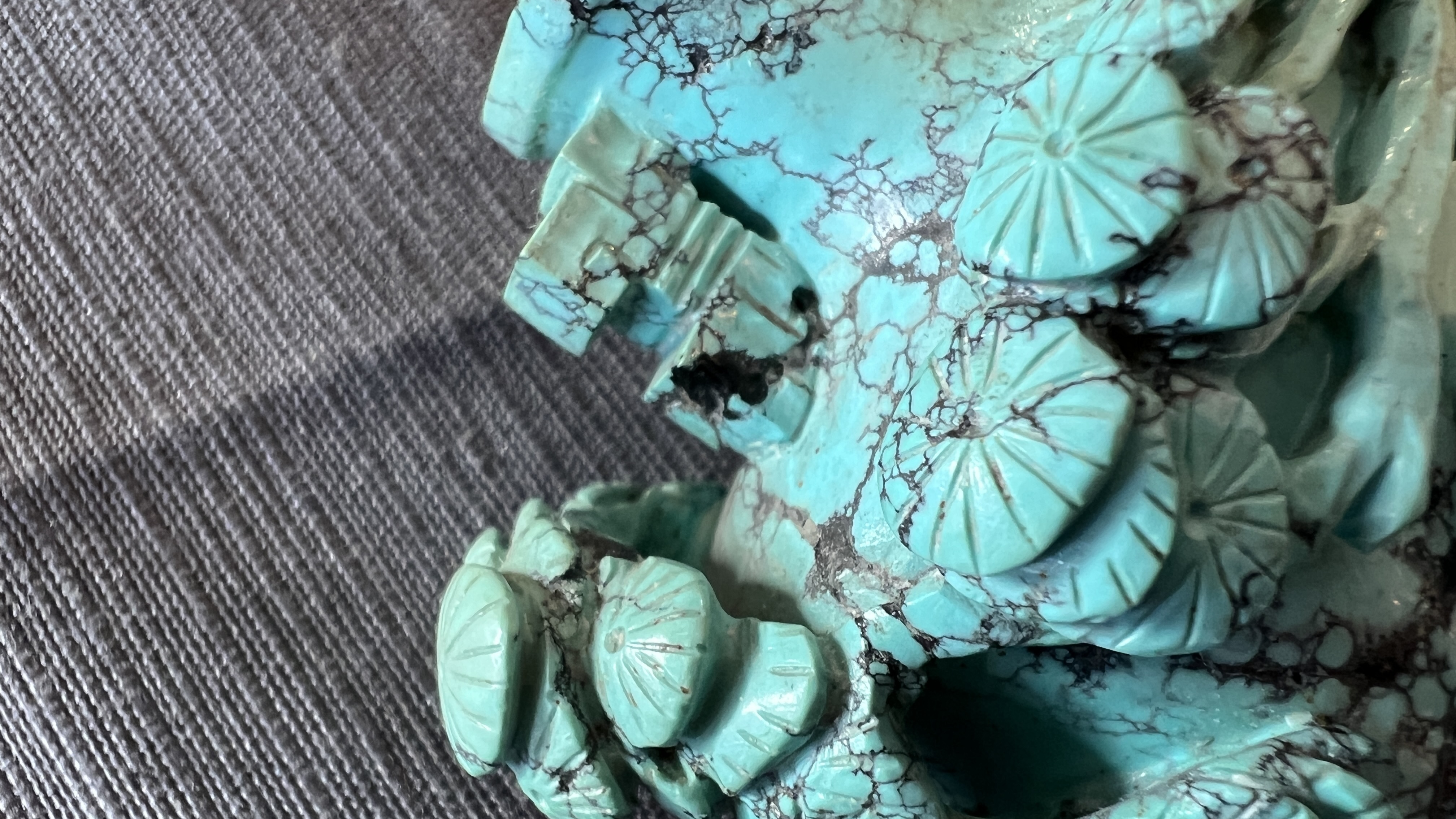 A Chinese carved turquoise vase and cover with a cat below a pine tree ...