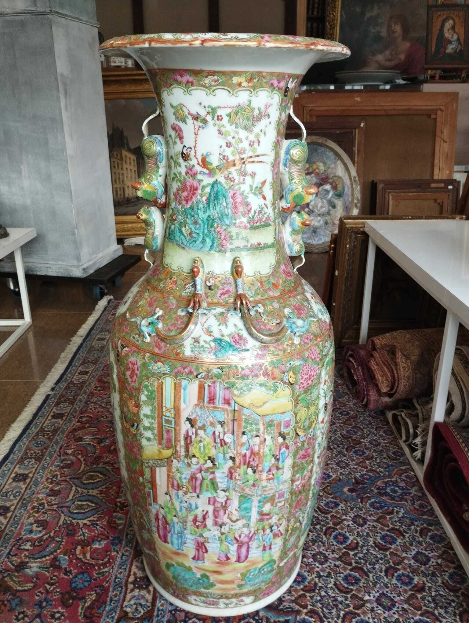 A large Chinese Canton famille rose vase with palace scenes and floral ...