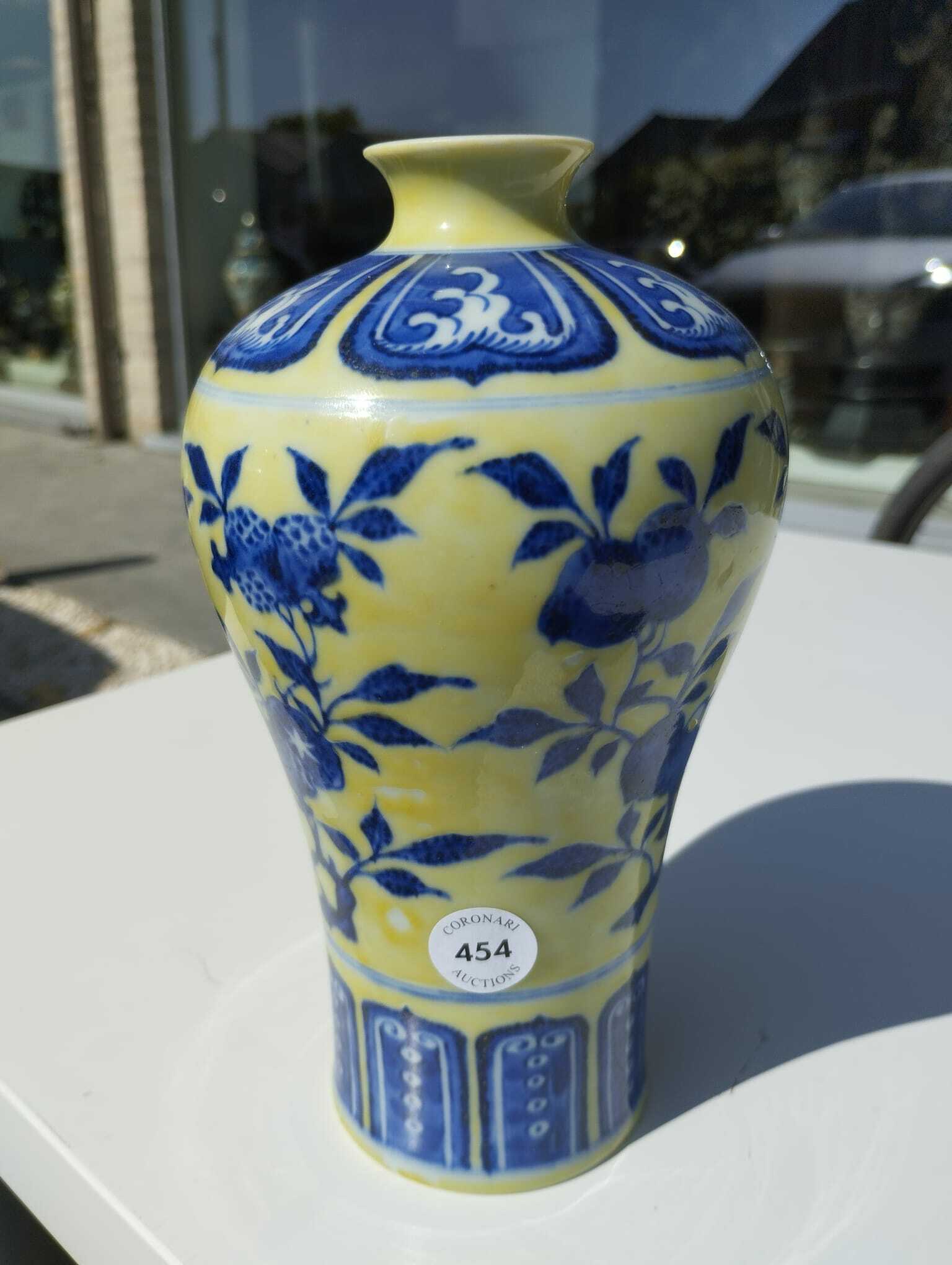 A Chinese blue and white yellow-ground meiping vase with sanduo design ...