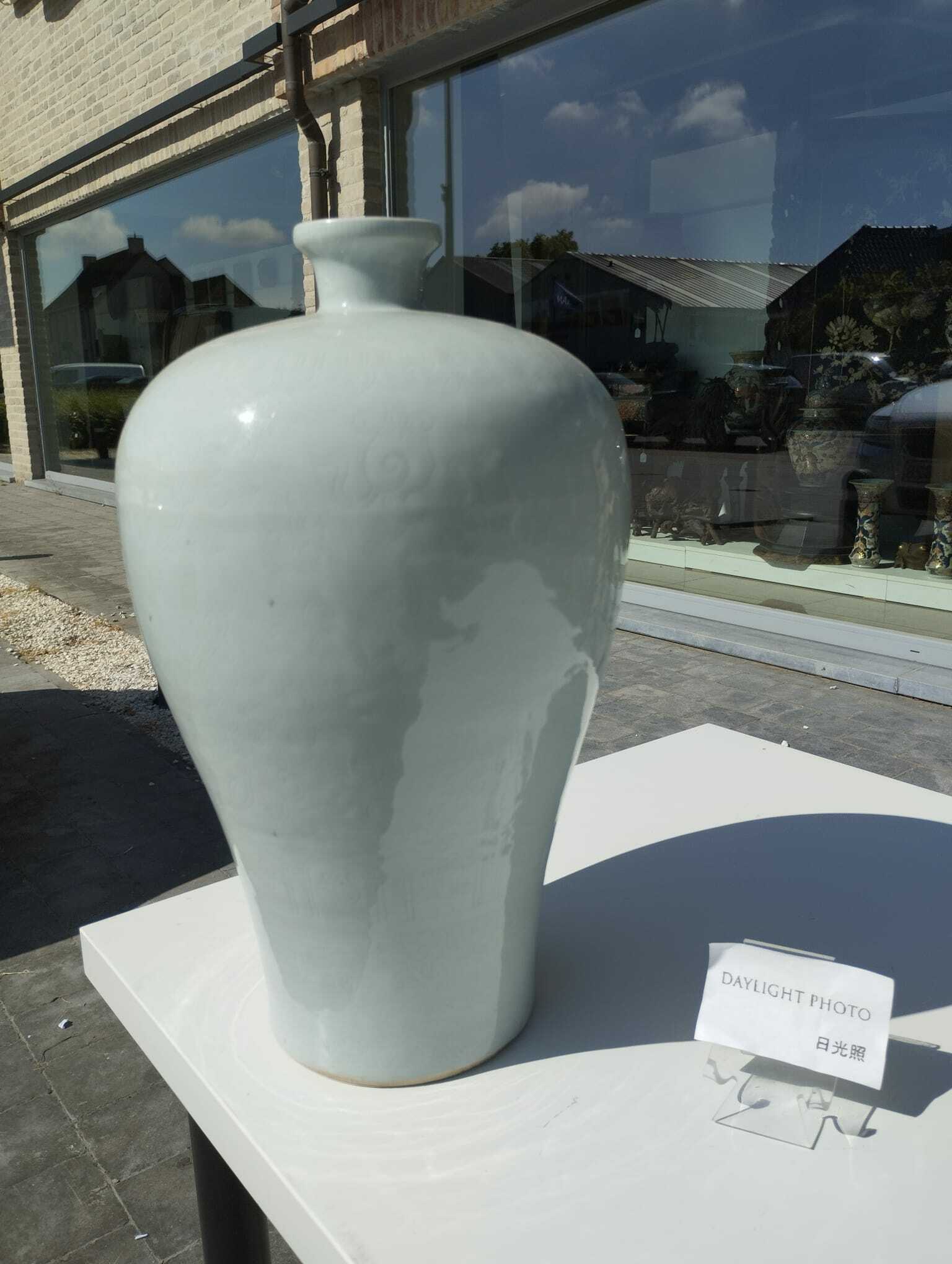 A Chinese monochrome white meiping vase with incised floral design ...