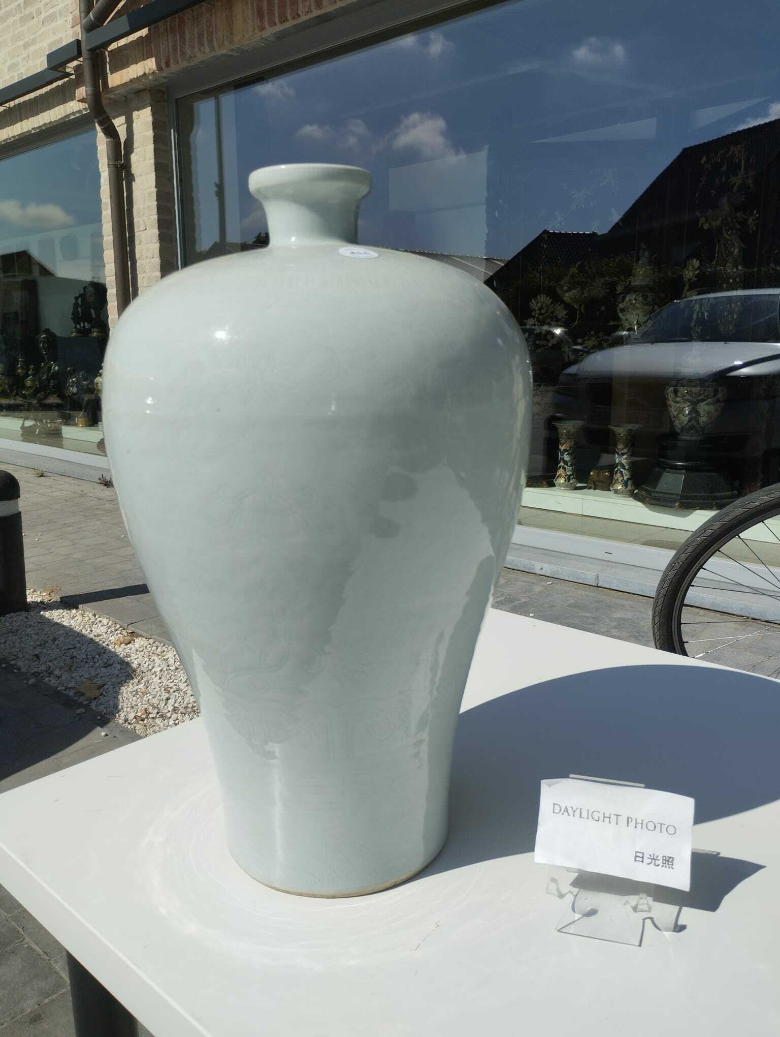 A Chinese monochrome white meiping vase with incised floral design ...