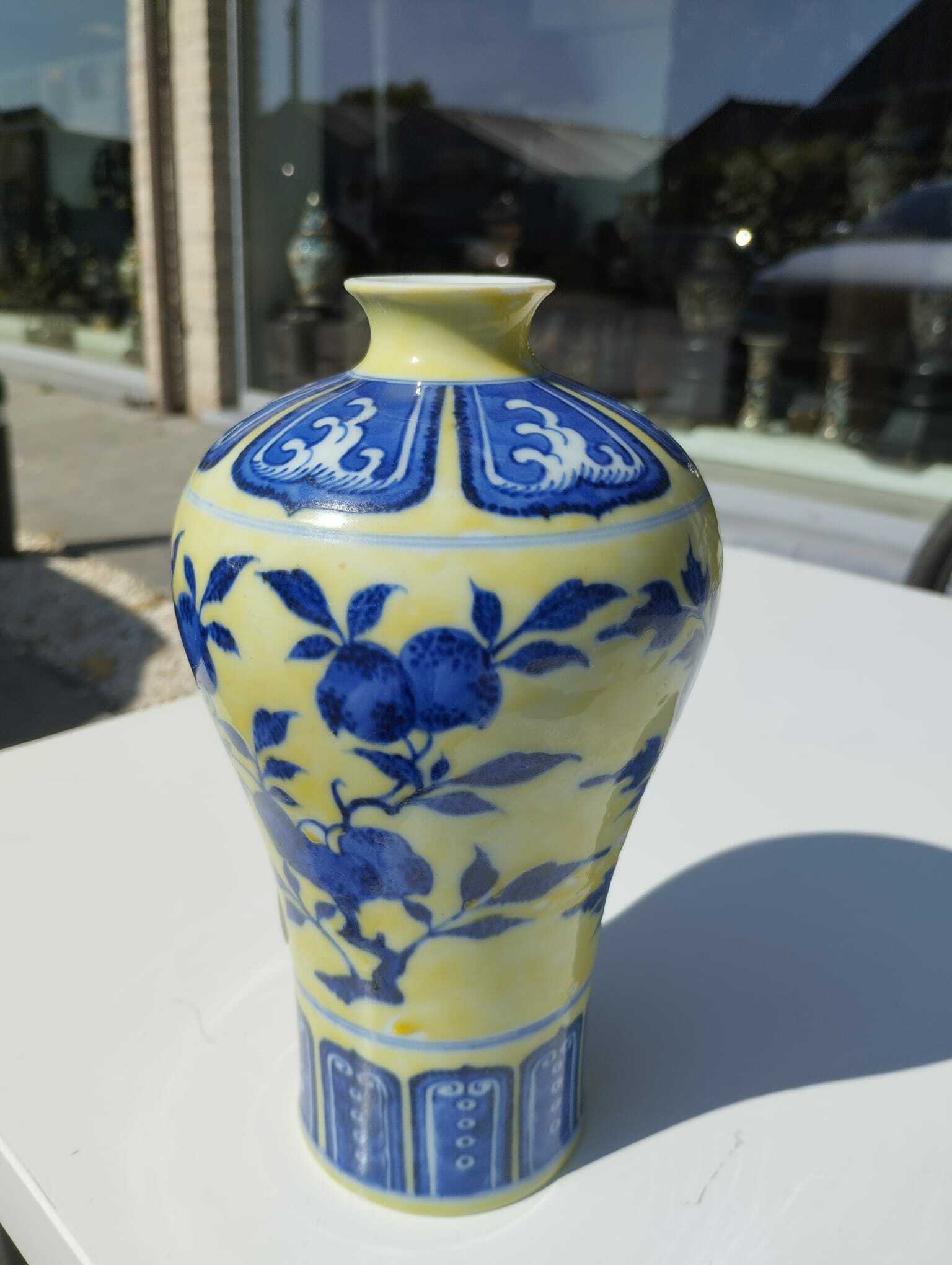 A Chinese blue and white yellow-ground meiping vase with sanduo design ...