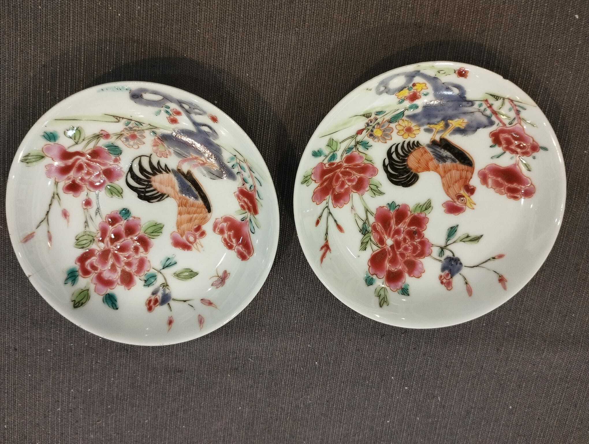 A pair of Chinese famille rose 'rooster' cups and saucers, Yongzheng ...
