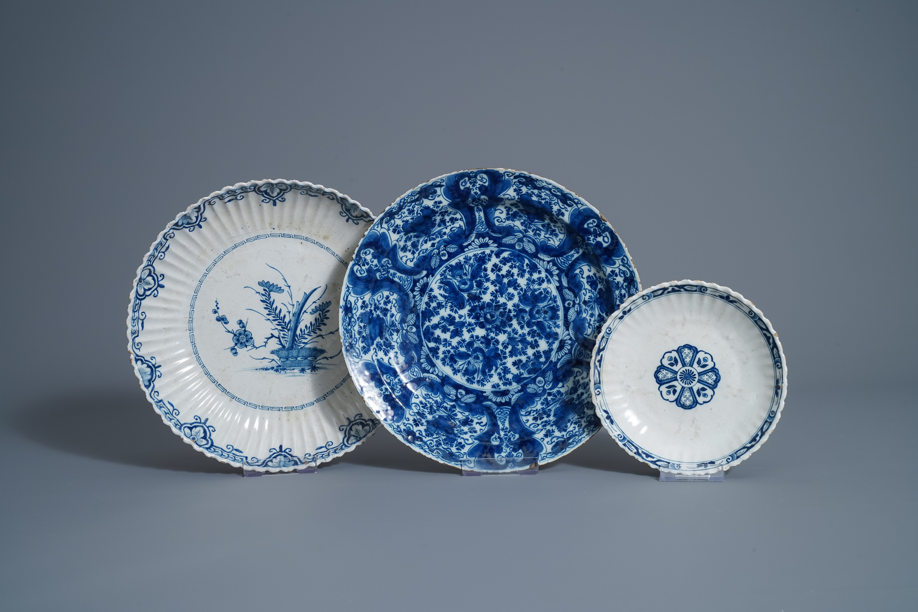 Two Dutch Delft blue and white dishes and a plate with floral design ...