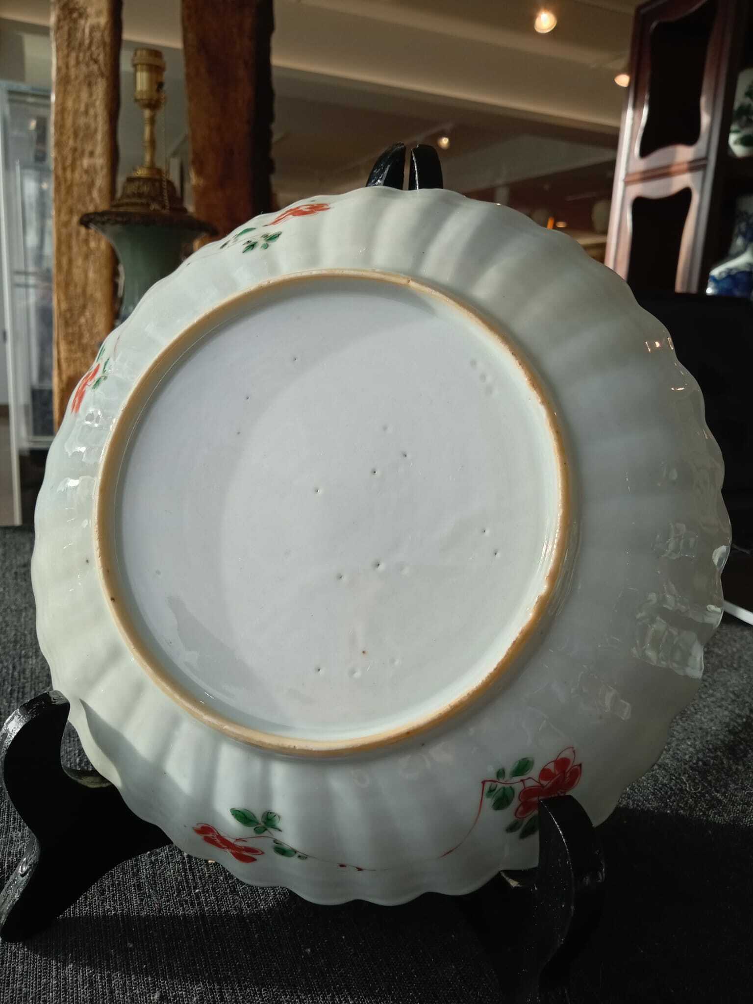 Two Chinese verte-Imari plates with floral design and a lady on a ...