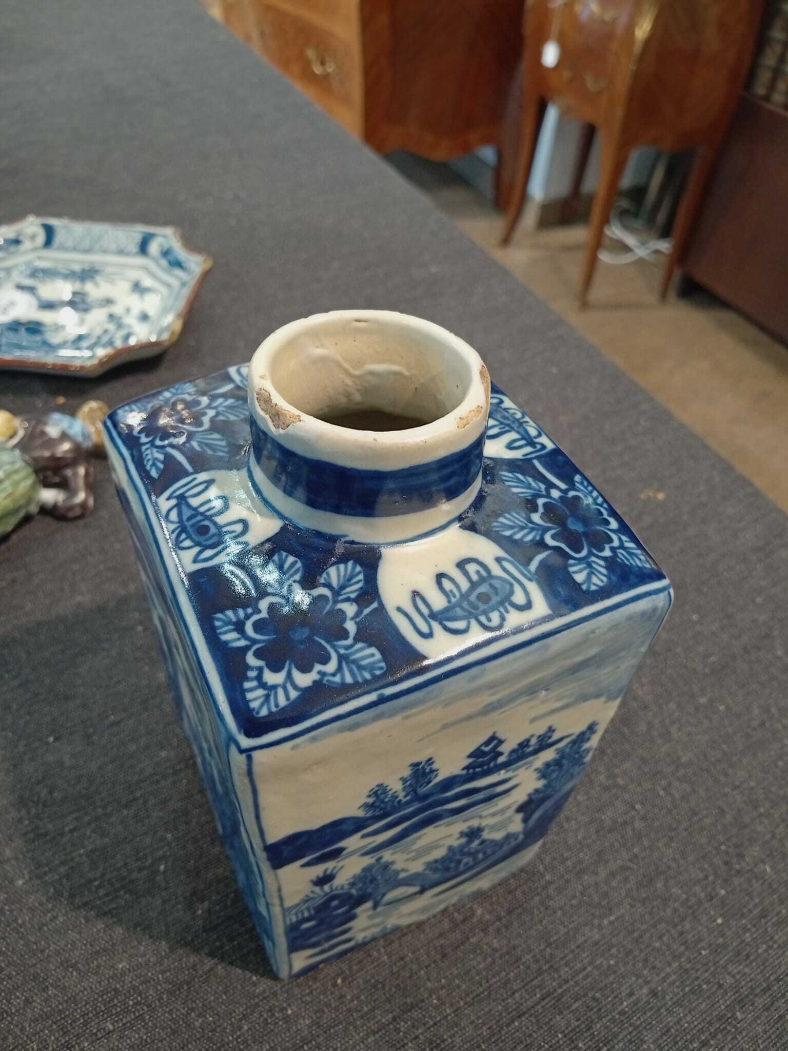 A varied collection of Dutch Delft blue and white items with figures in ...