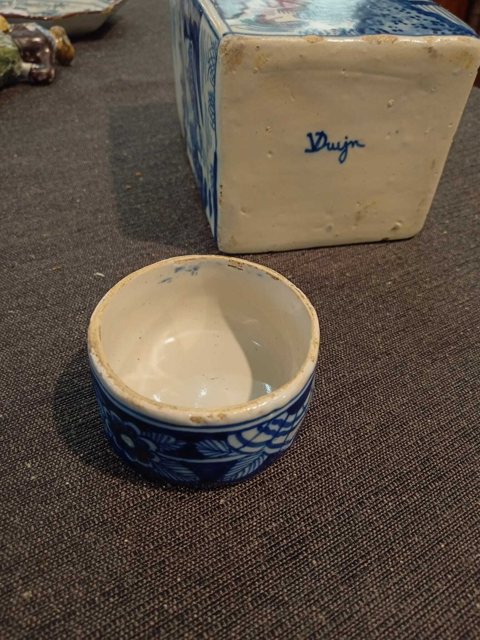 A varied collection of Dutch Delft blue and white items with figures in ...