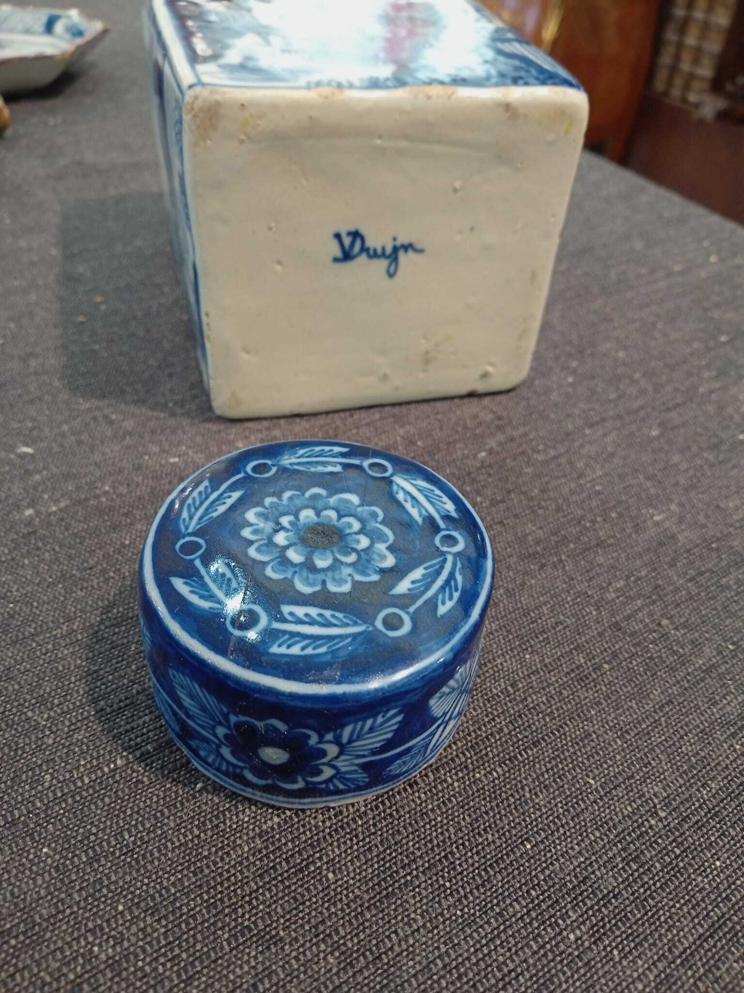 A varied collection of Dutch Delft blue and white items with figures in ...