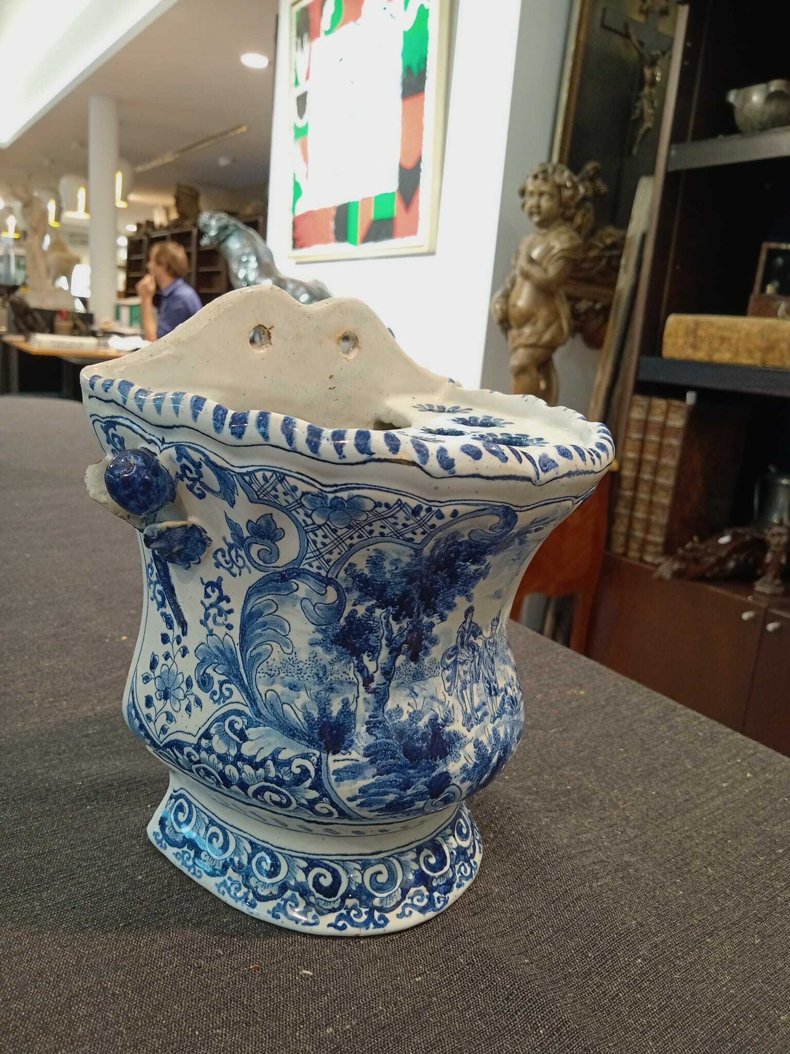 A varied collection of Dutch Delft blue and white items with figures in ...