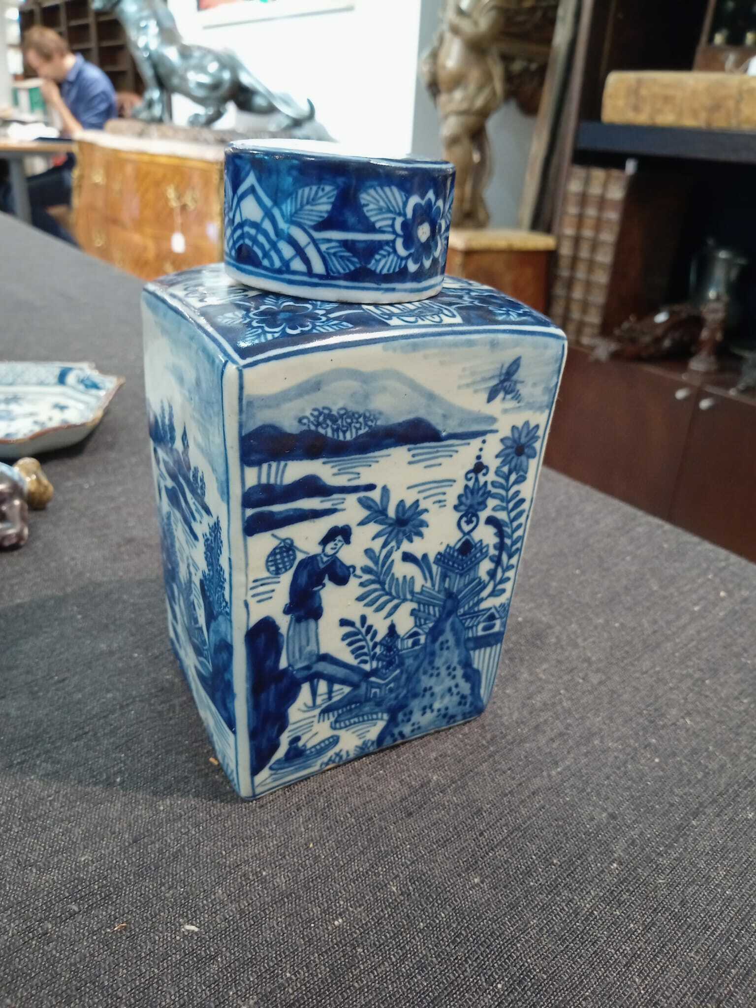 A varied collection of Dutch Delft blue and white items with figures in ...