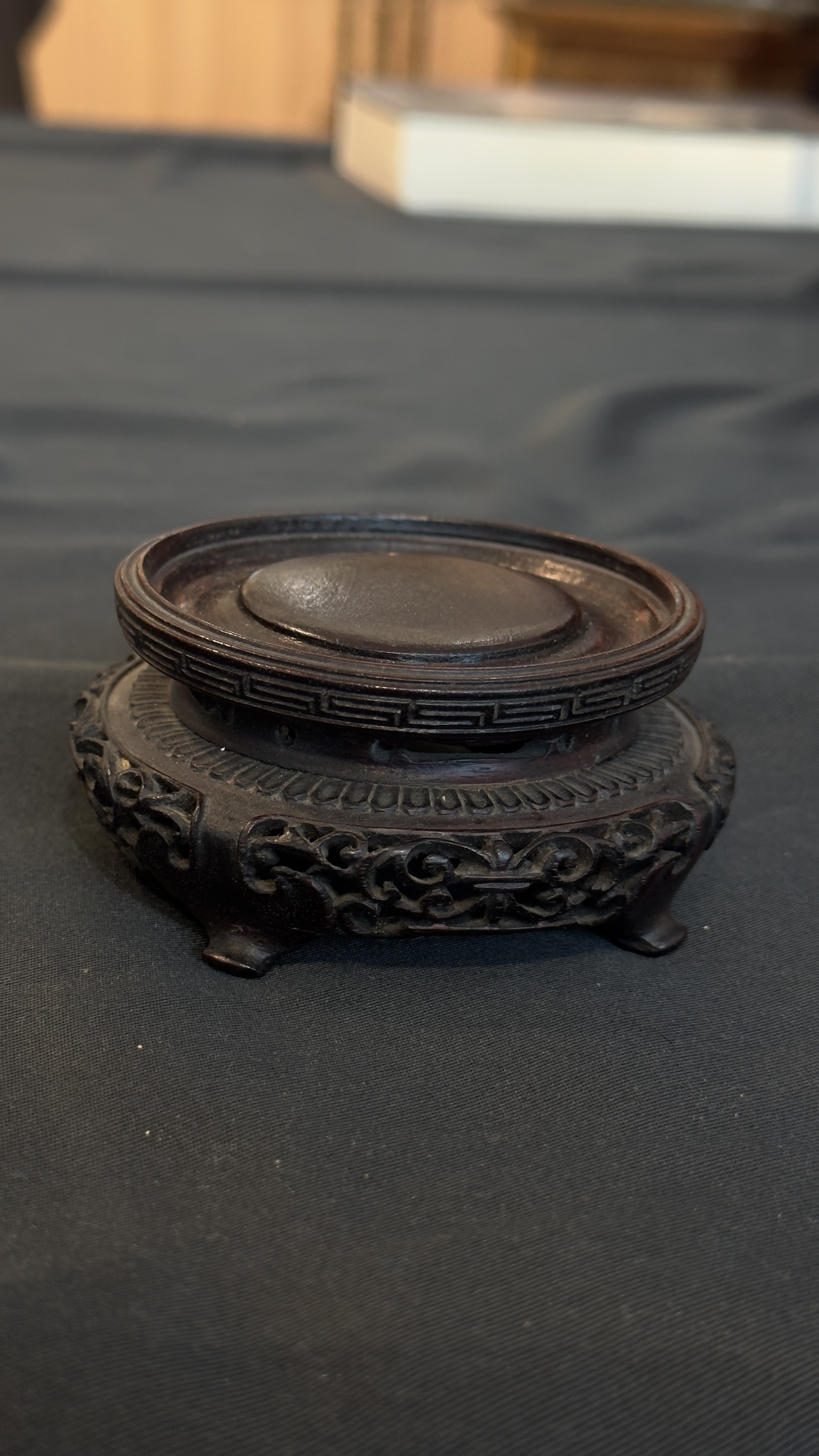 A Chinese doucai bottle-shaped and inscribed 'Kui Xing' vase on wooden ...