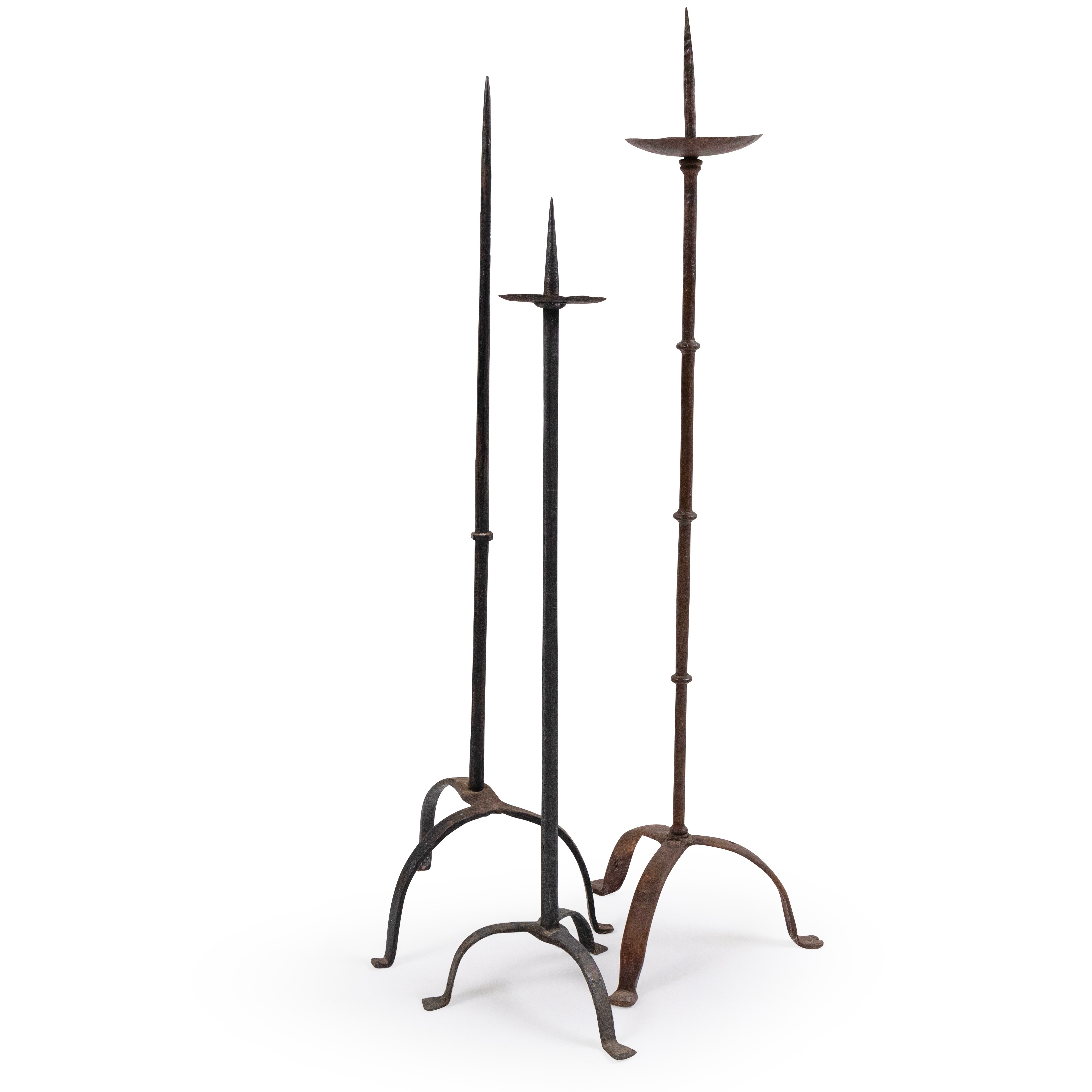 Three large wrought iron Gothic Revival candlesticks, 19th C ...